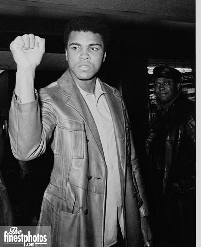 Muhammad Ali with raised fist - The Finest Photos